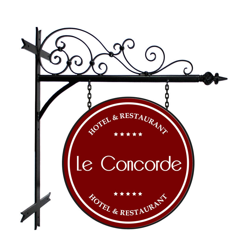 Enseigne émaillée ronde sur potence en fer forgé arabesques – Plomeis